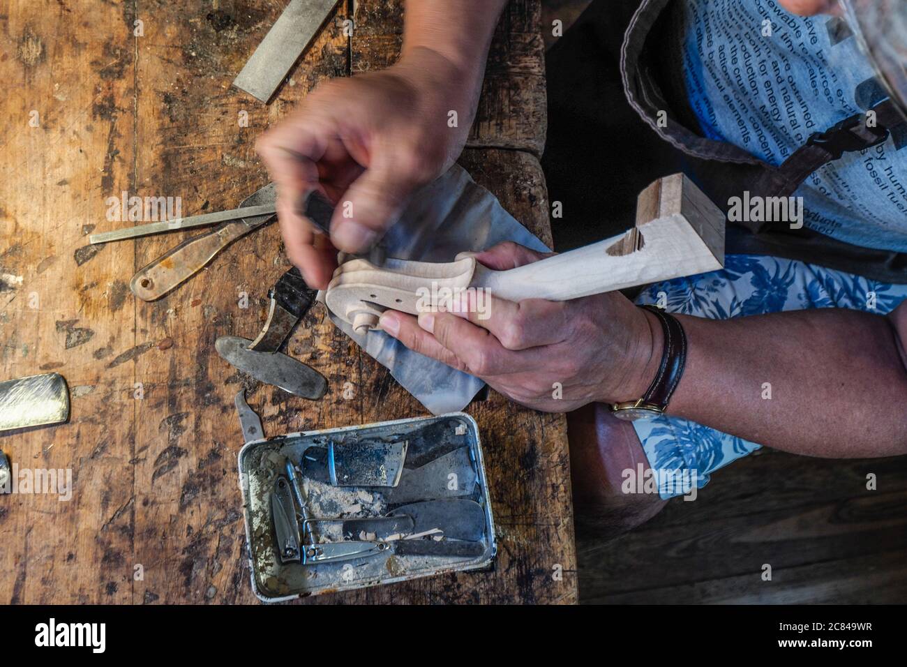 Hands of luthier violin maker carving and working on a instrument ...