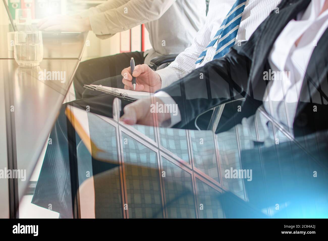 Business people taking notes during a training; multiple exposure Stock ...
