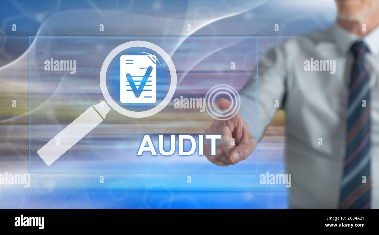 Man touching an audit concept on a touch screen with his finger Stock ...