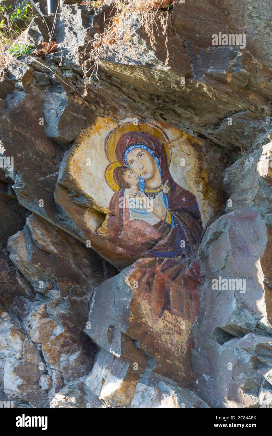 Painted Christian icon on a rock. The Blessed Virgin Mary and Baby ...