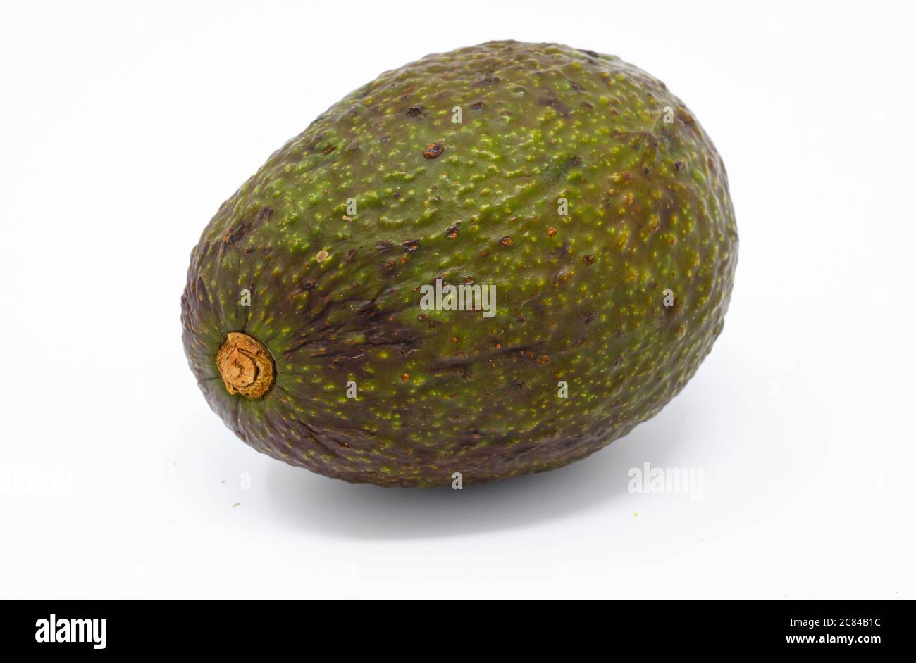 A photograph of a Single avocado Pear Stock Photo - Alamy