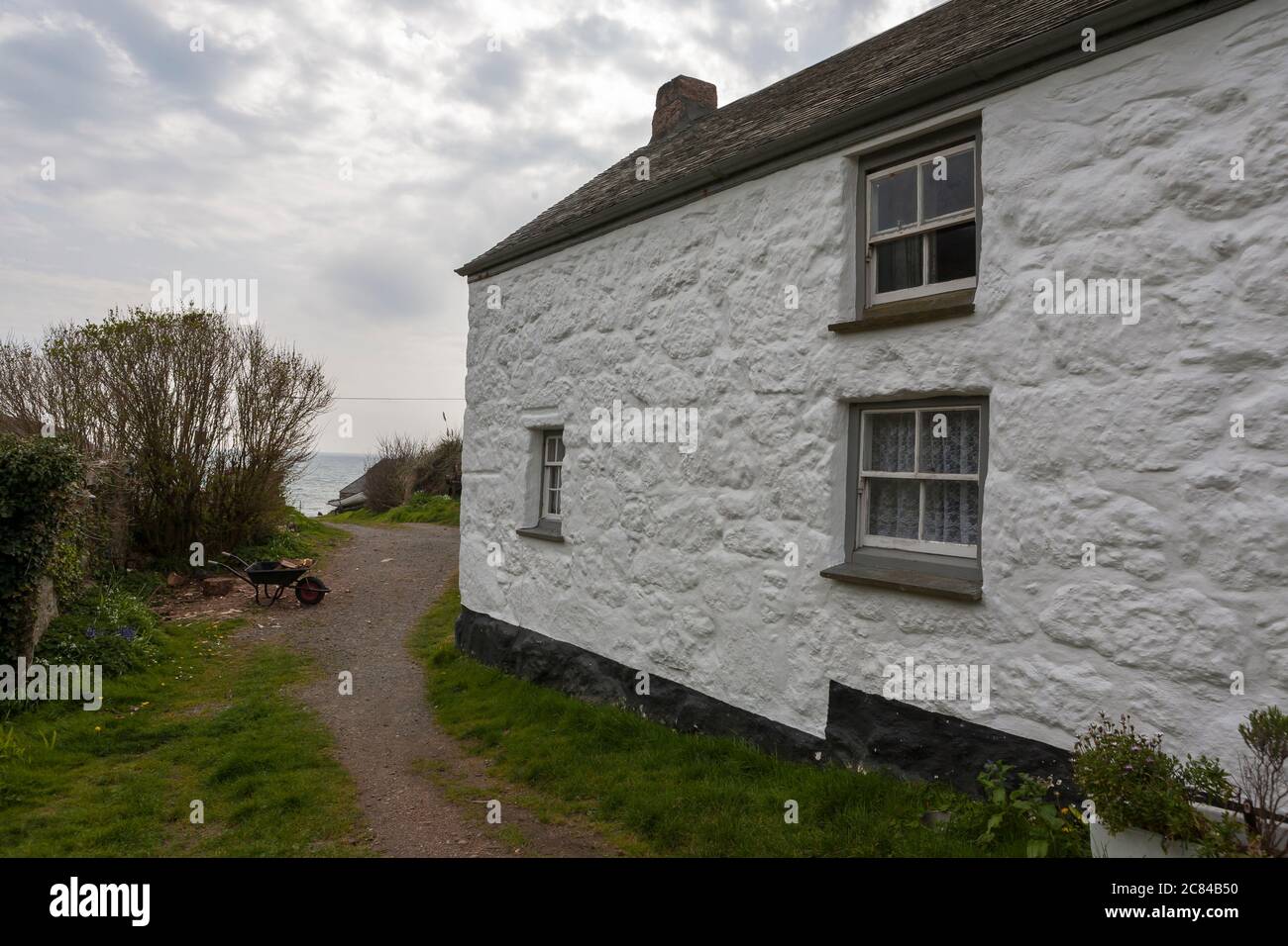Lone cottage, Penberth Cove, Penwith Peninsula, Cornwall, England, UK ...