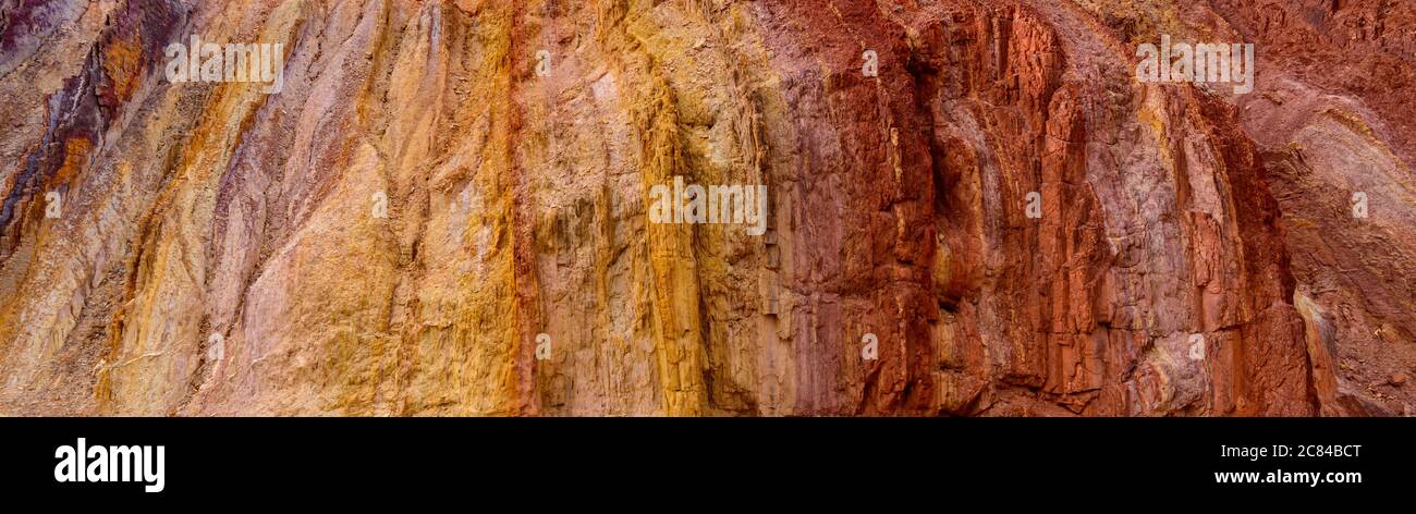 Yellow-red shaded rock layer surface Stock Photo - Alamy