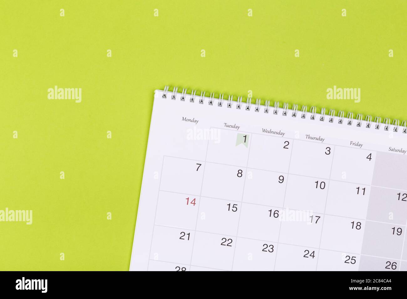 Open calendar on the table with green background, planning a business ...