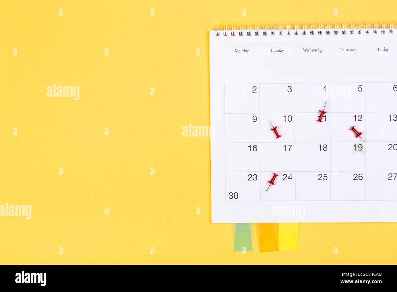 White clean calendar on solid yellow background with copy space ...
