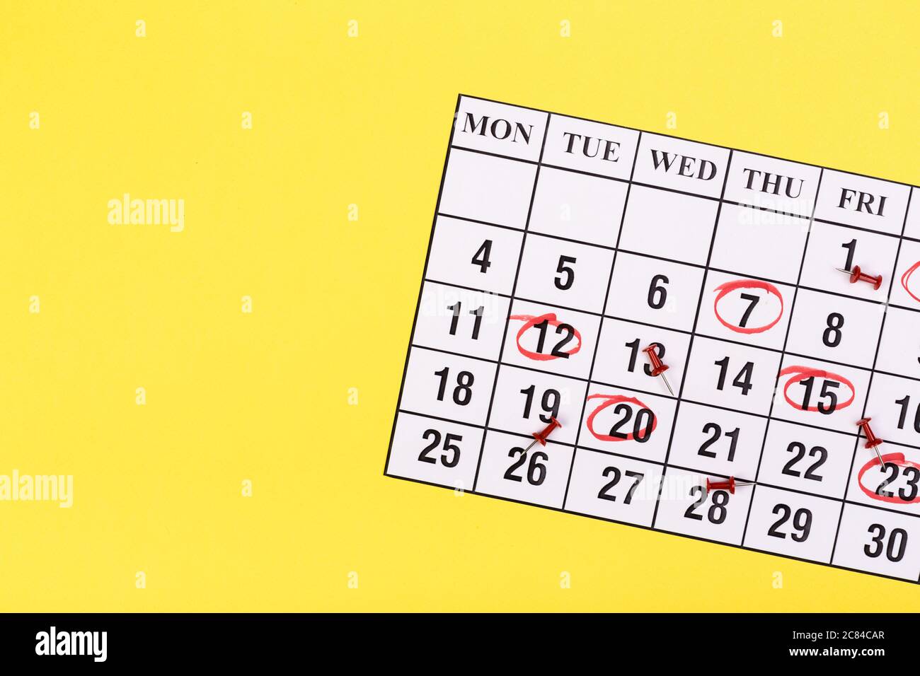 White clean calendar on solid yellow background with copy space ...