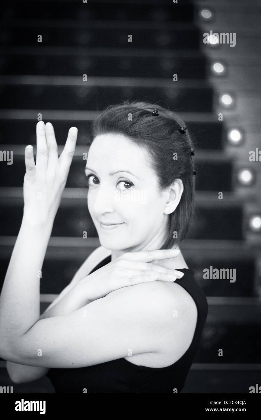 Portrait of 40 year old woman with arms in ballerina pose Stock Photo ...