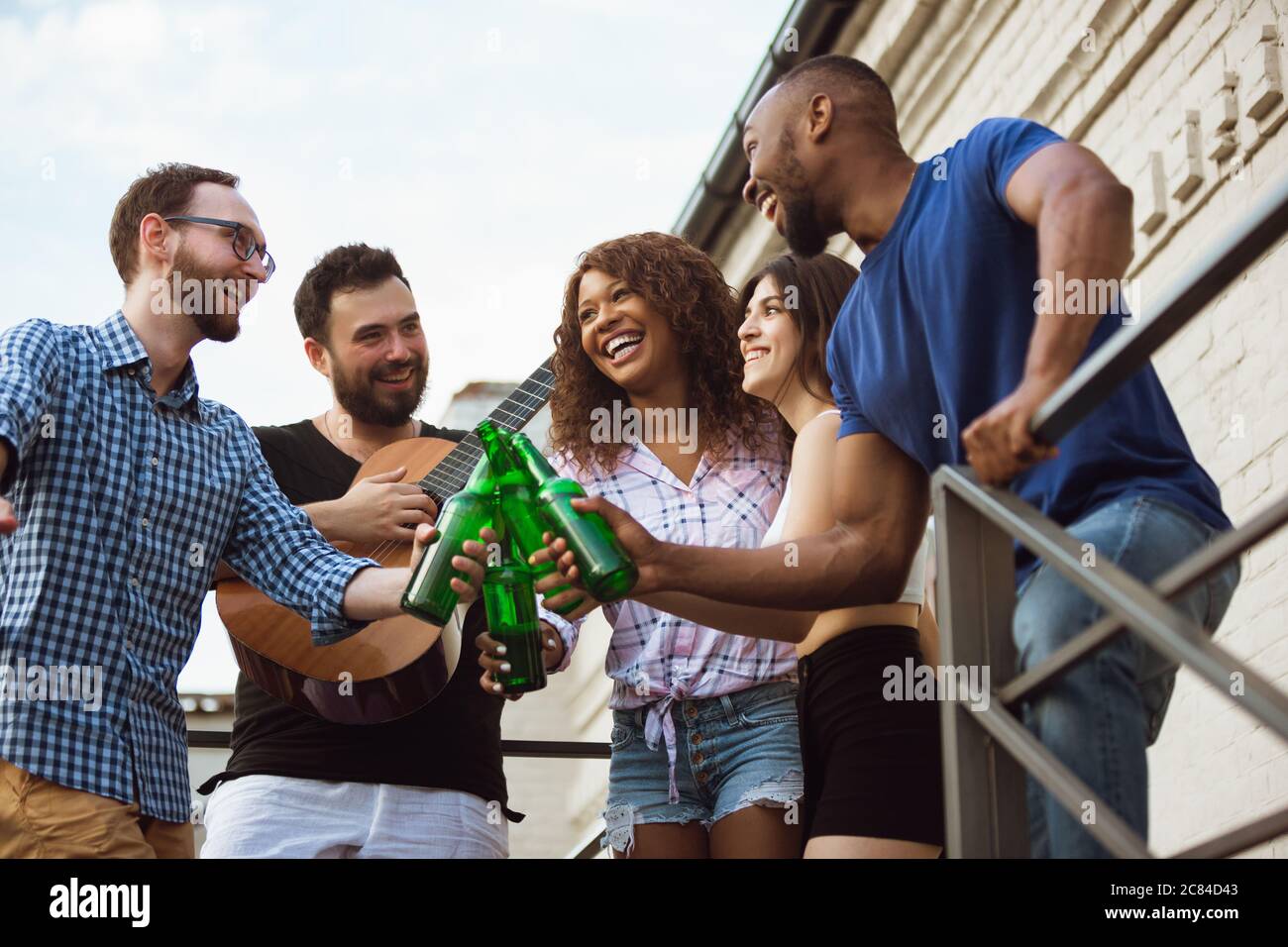 Group of happy friends having beer party in summer day. Resting ...