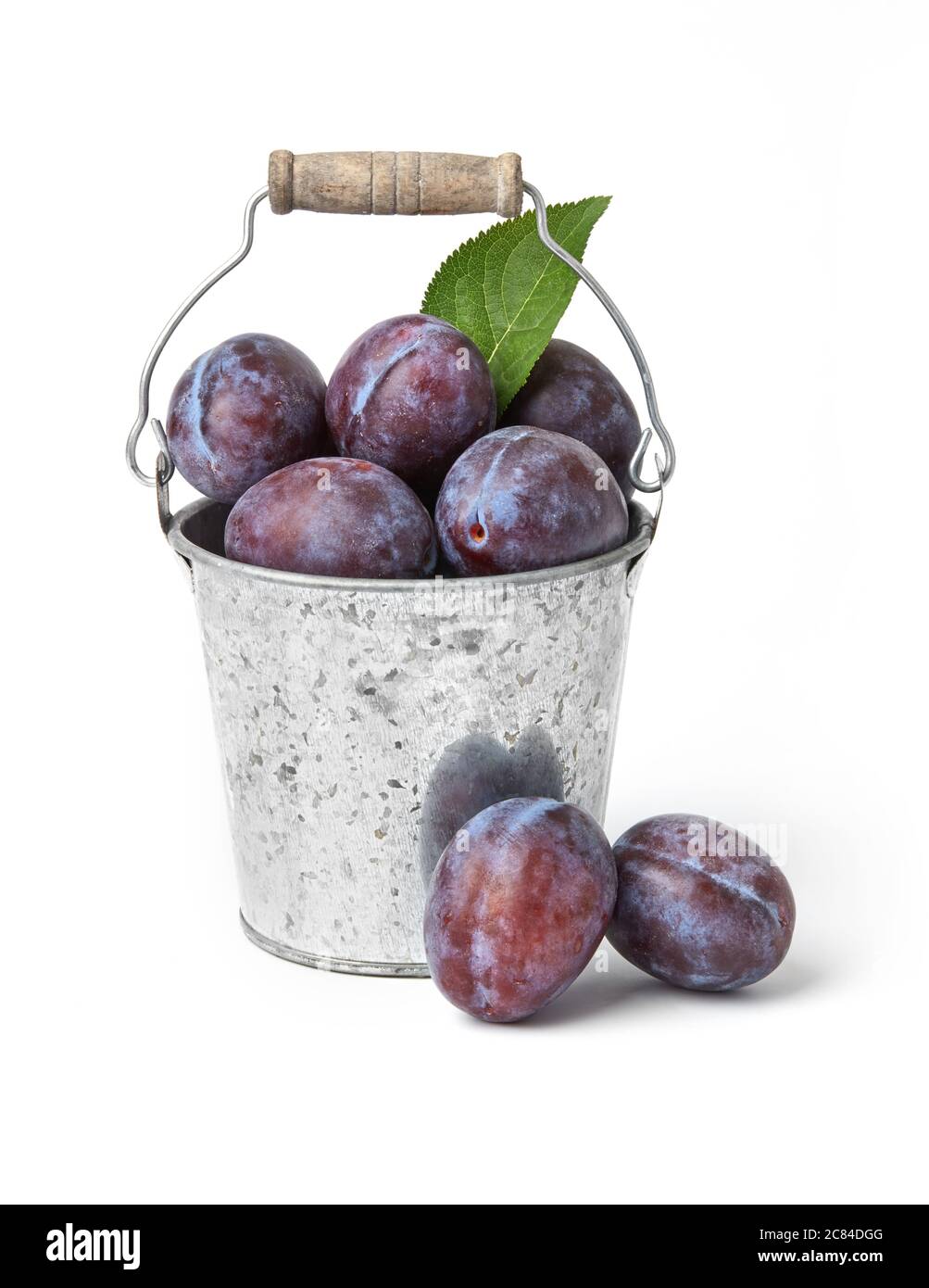 Farm plums with leaves isolated on white Stock Photo - Alamy