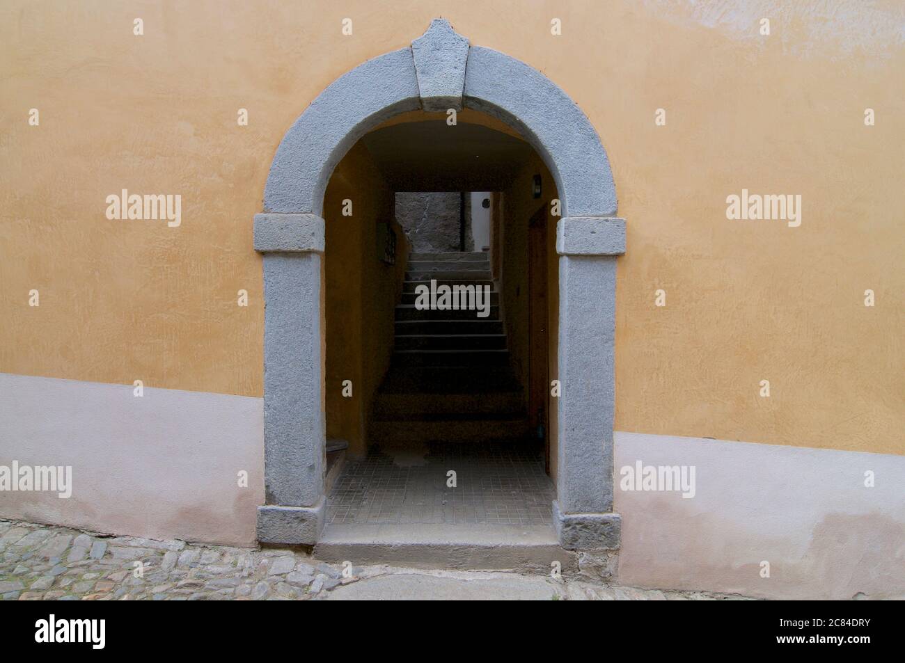 Typical view of an alley entrance taken in the old village center of ...