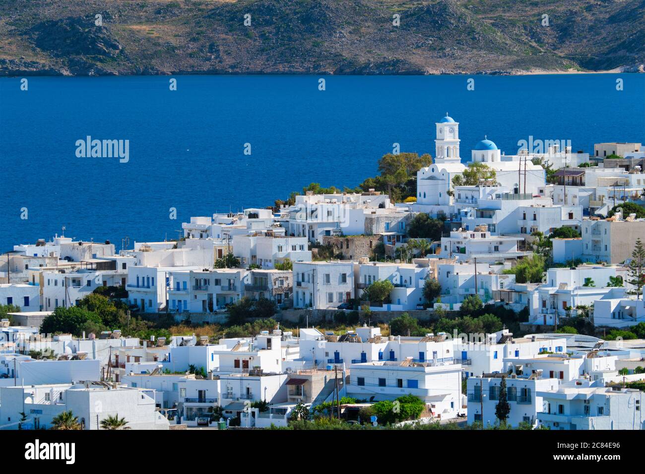 View of Plaka village with traditional Greek church. Milos island ...
