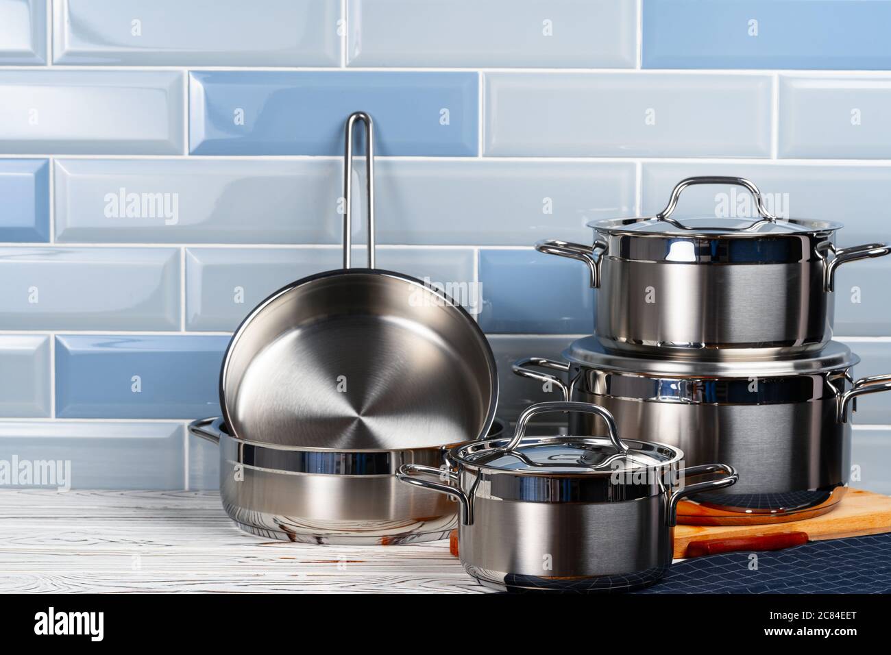 Set of aluminum cookware on kitchen counter Stock Photo - Alamy