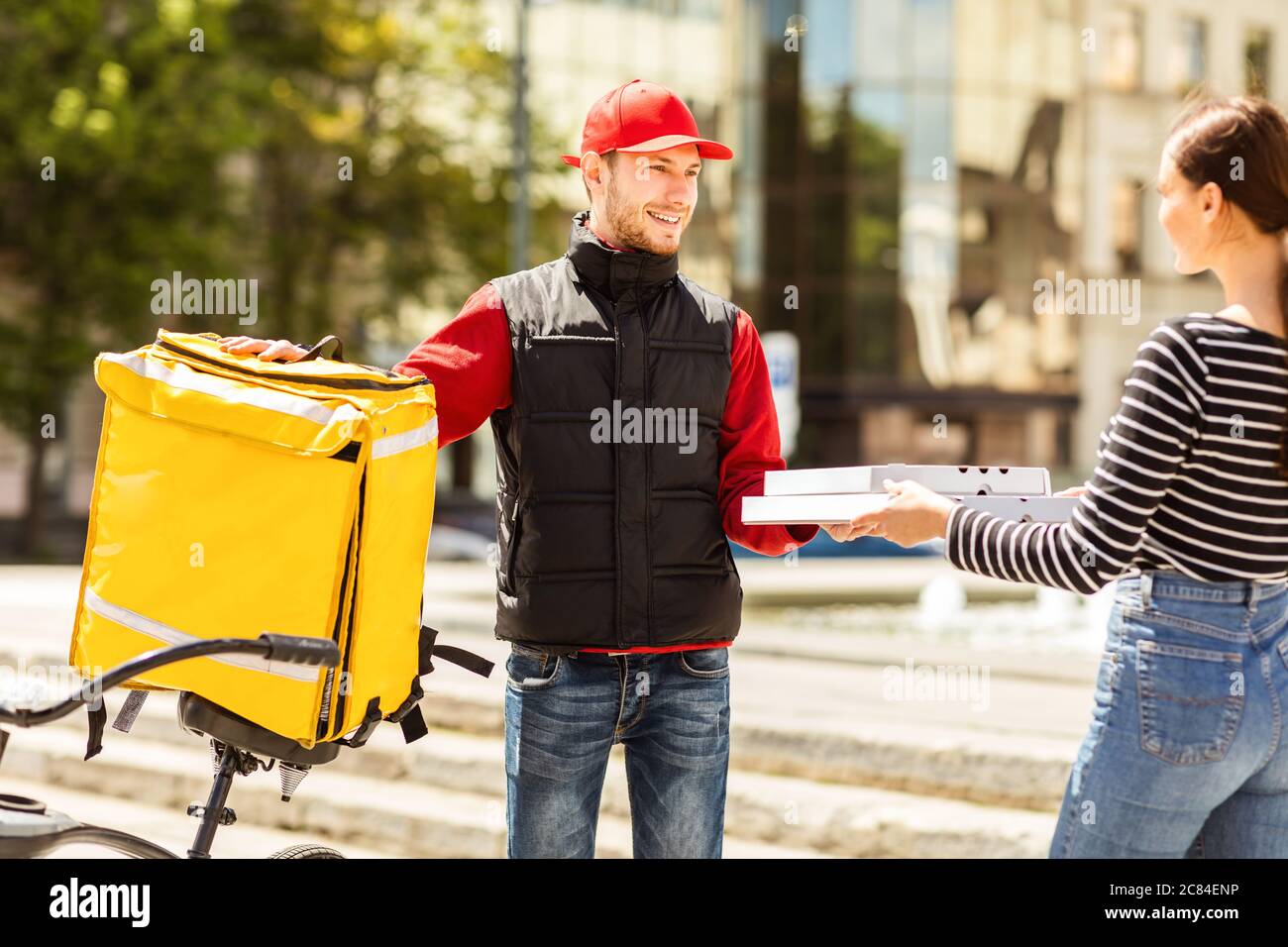 Courier Delivering Order To Customer Giving Pizzas Boxes Outdoors Stock ...