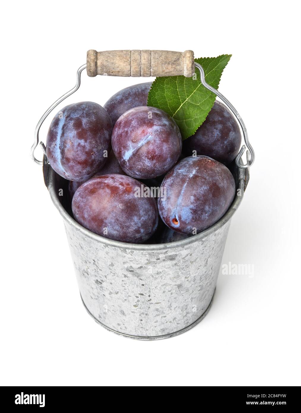 Farm plums with leaves isolated on white Stock Photo - Alamy