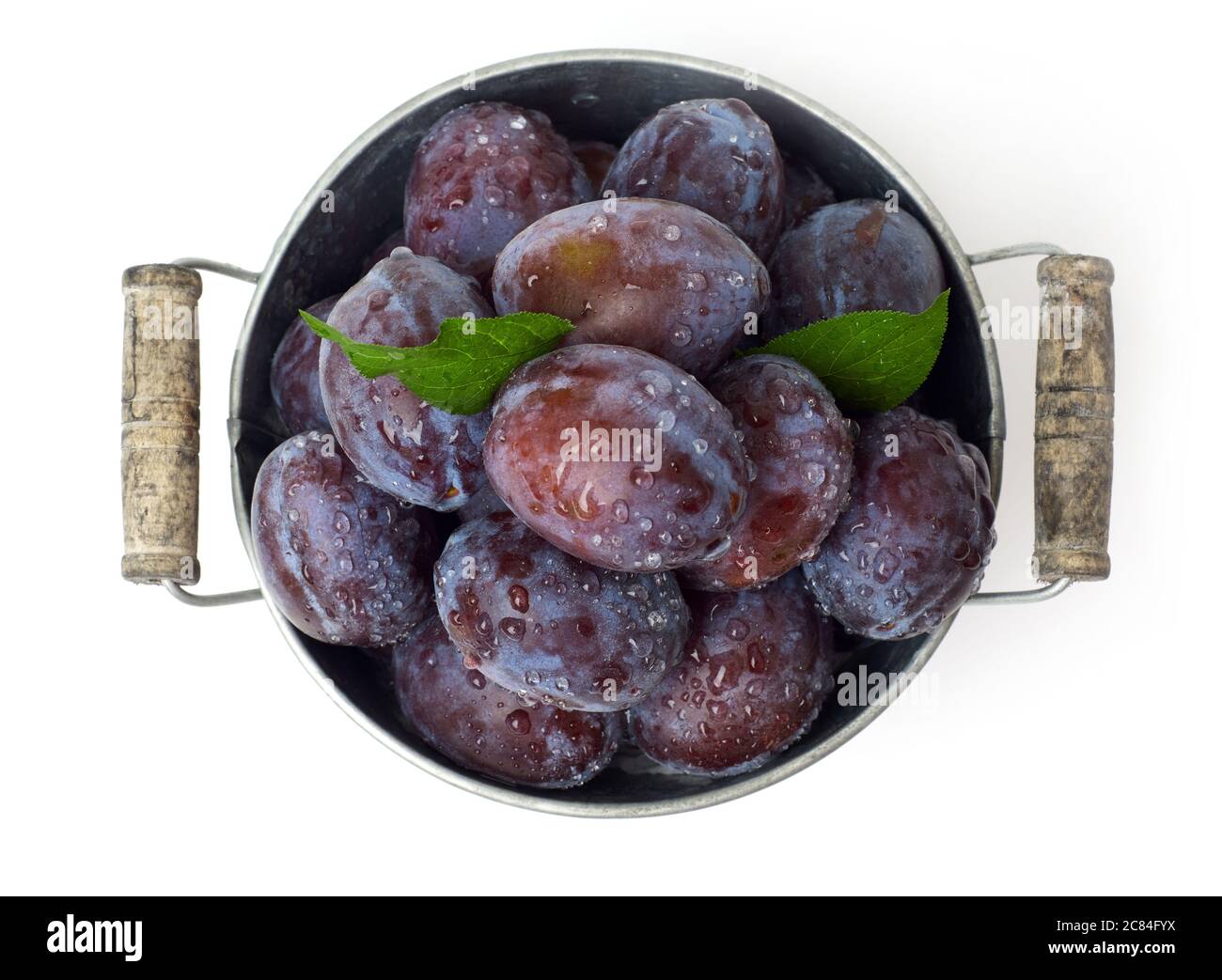 Farm plums with leaves isolated on white Stock Photo - Alamy