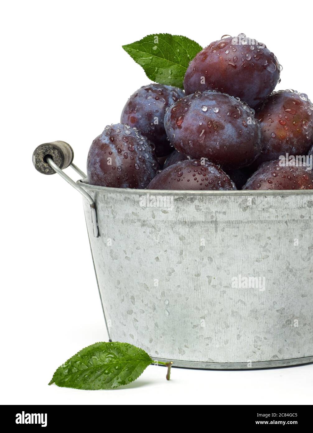 Farm plums with leaves isolated on white Stock Photo - Alamy