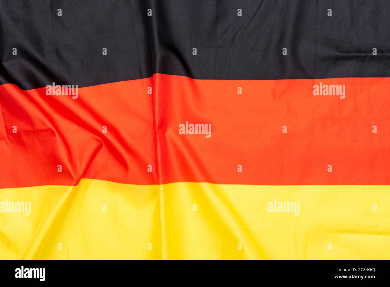 Natural fabric crumpled flag of Germany or German flag Stock Photo - Alamy