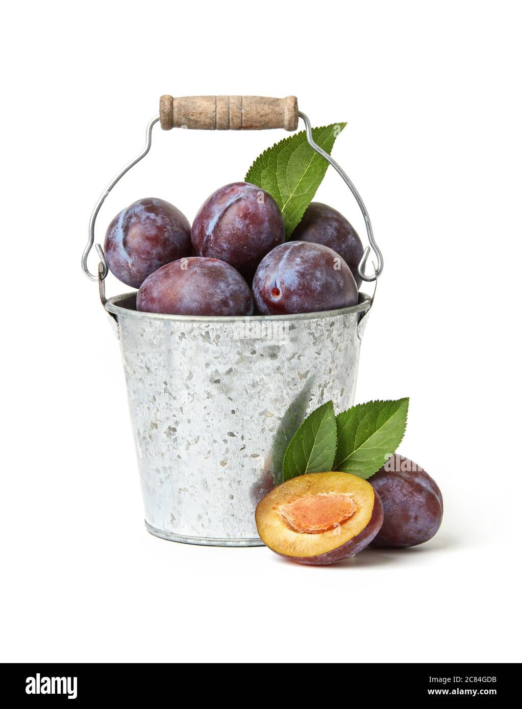 Farm plums with leaves isolated on white Stock Photo - Alamy
