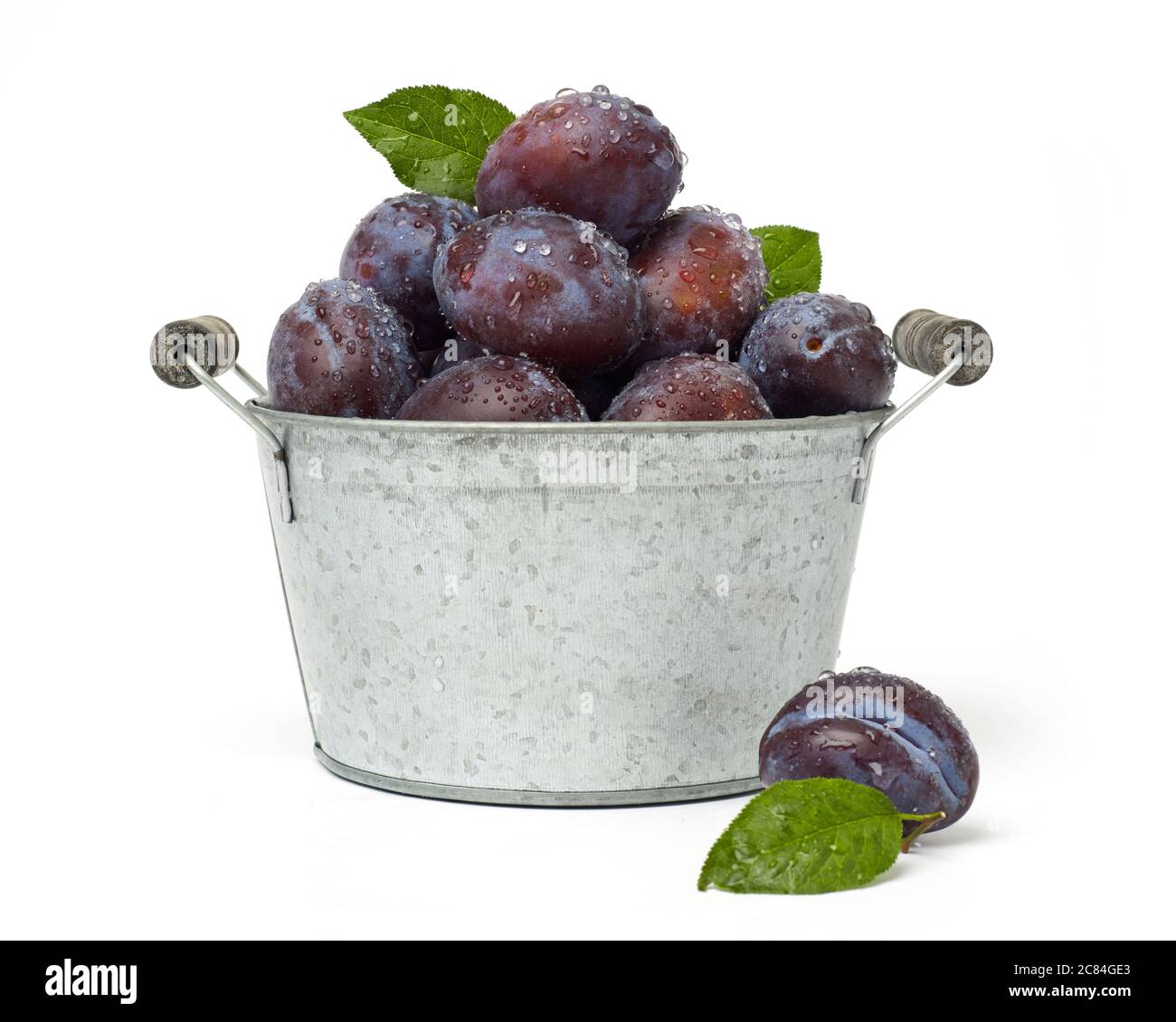Farm plums with leaves isolated on white Stock Photo - Alamy