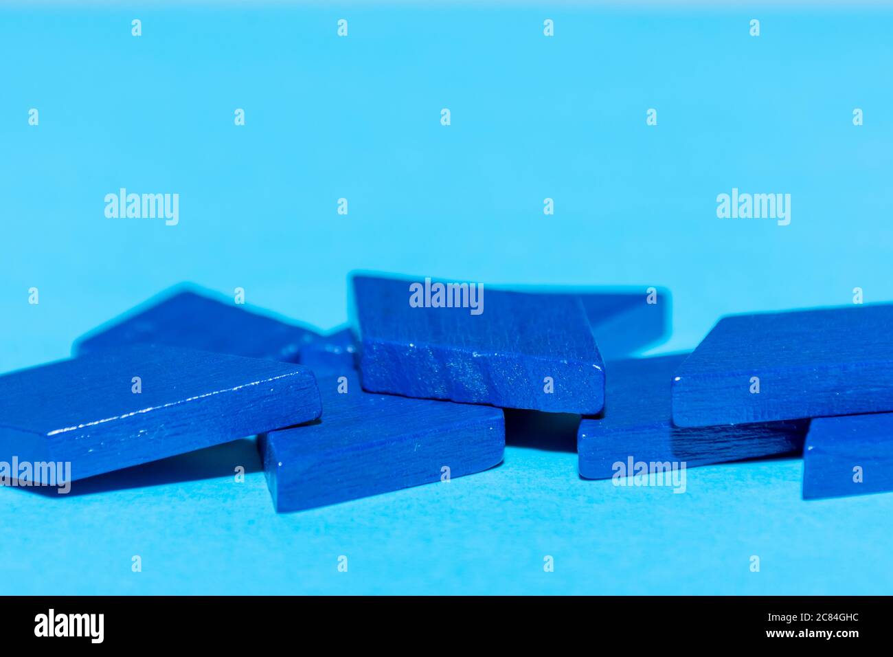 Bright colored blue tangram child geometric shape puzzle pieces in a ...