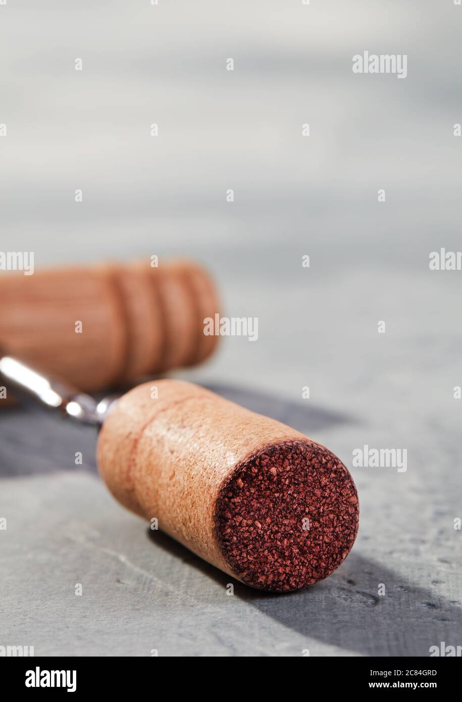 Wine cork and bottle opener on white background Stock Photo - Alamy