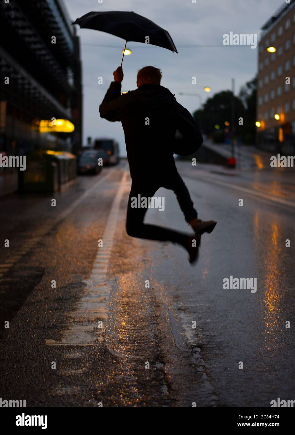 Man singing in the rain hi-res stock photography and images - Alamy