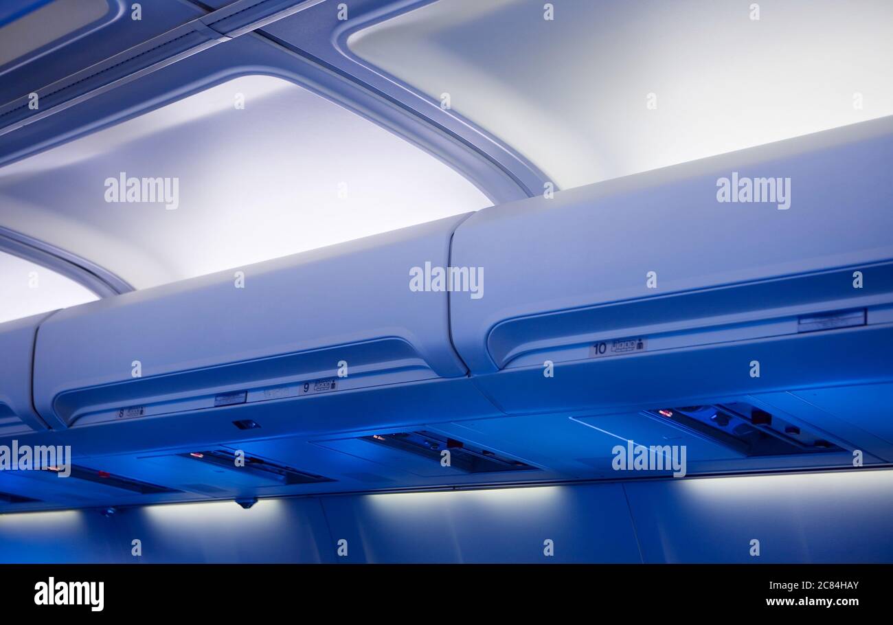 Storage compartments in a plane Stock Photo - Alamy