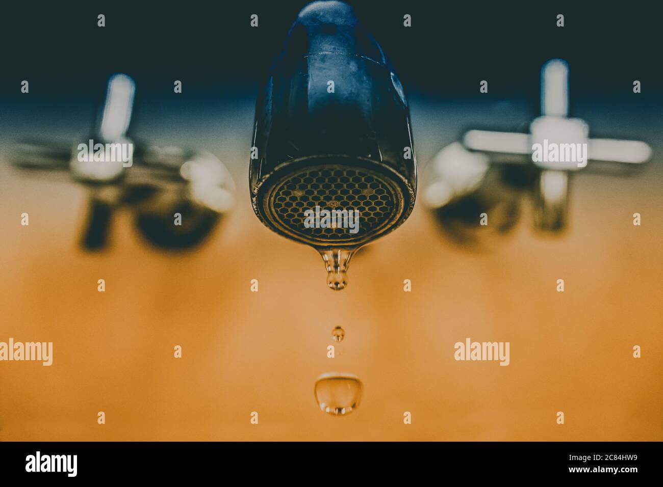 Metal tap and drops close up Stock Photo - Alamy
