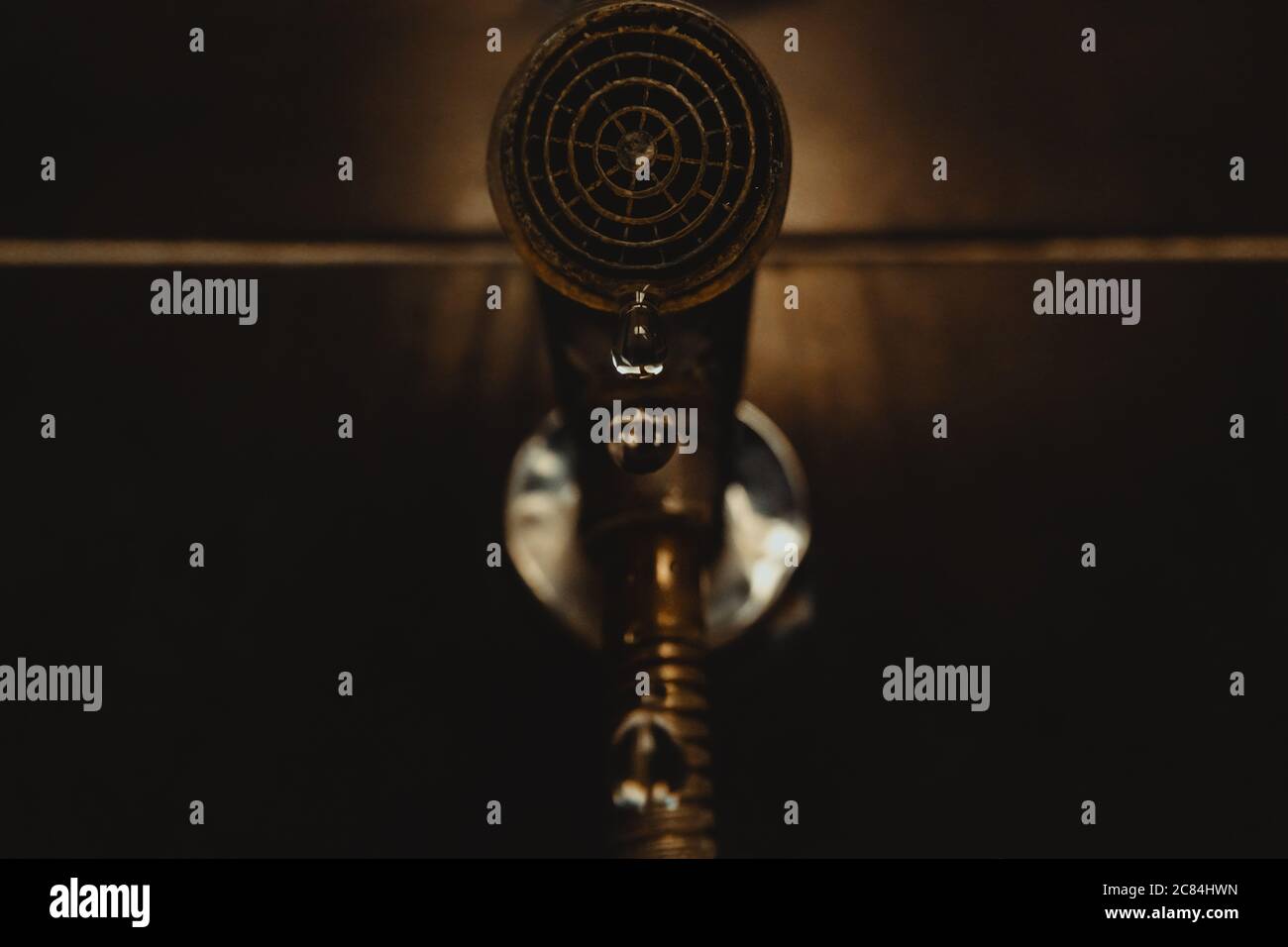 Metal tap and drops close up Stock Photo - Alamy