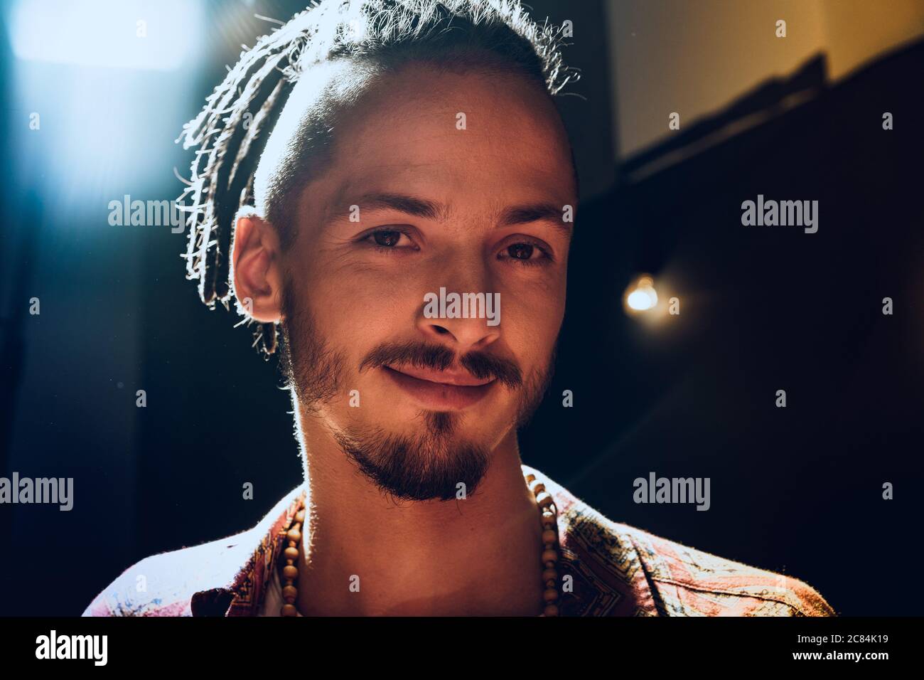 Close-up portrait of a young stylish man with dreadlocks Stock Photo ...