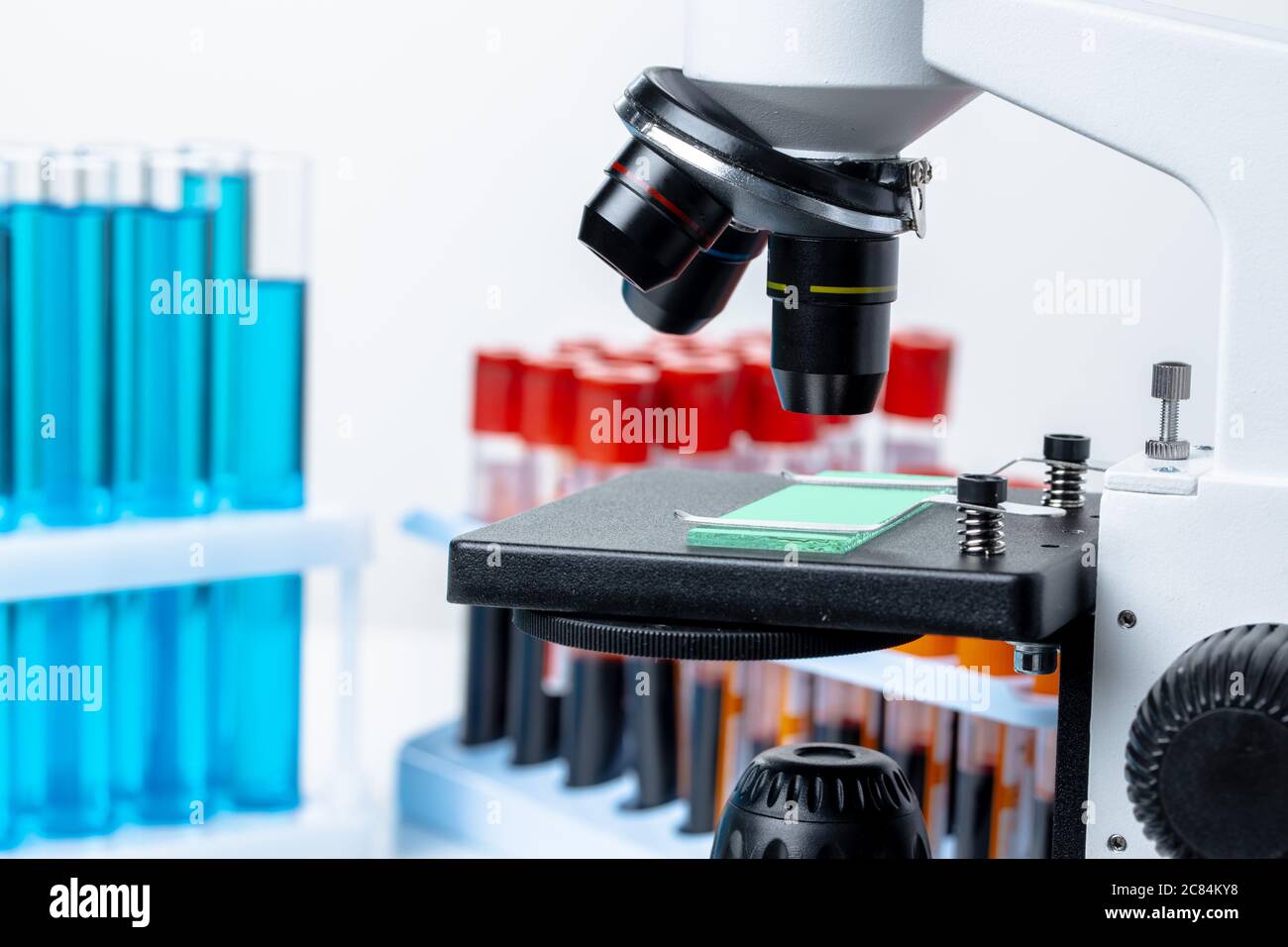 Microscope with test tubes for research close up Stock Photo - Alamy