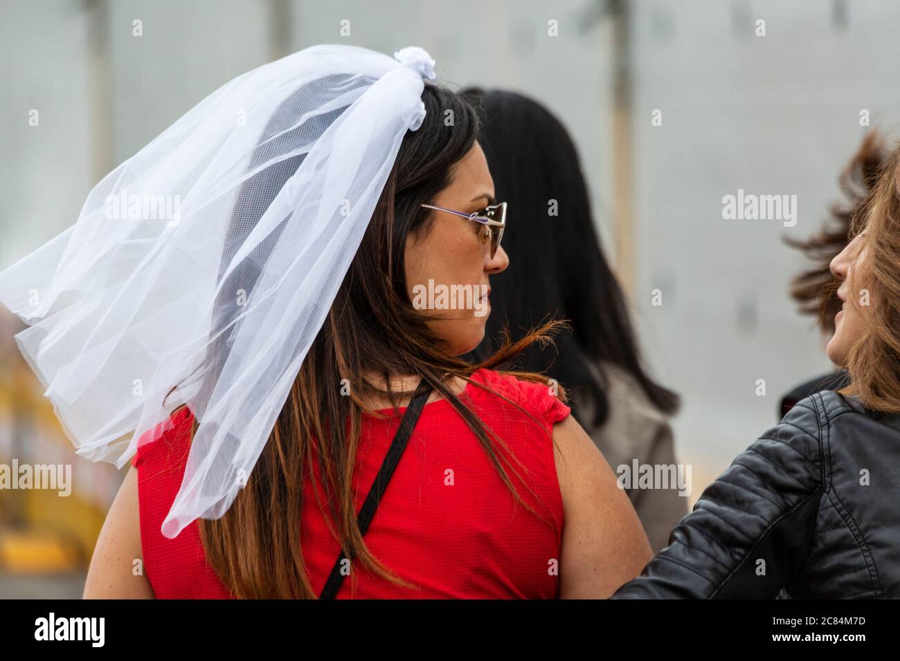 A woman on a hen weekend walking along a street Stock Photo - Alamy