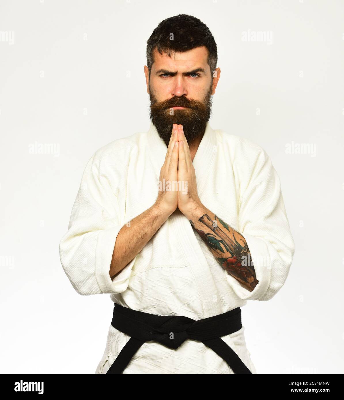 Karate man with strict face in uniform. Japanese martial arts concept ...