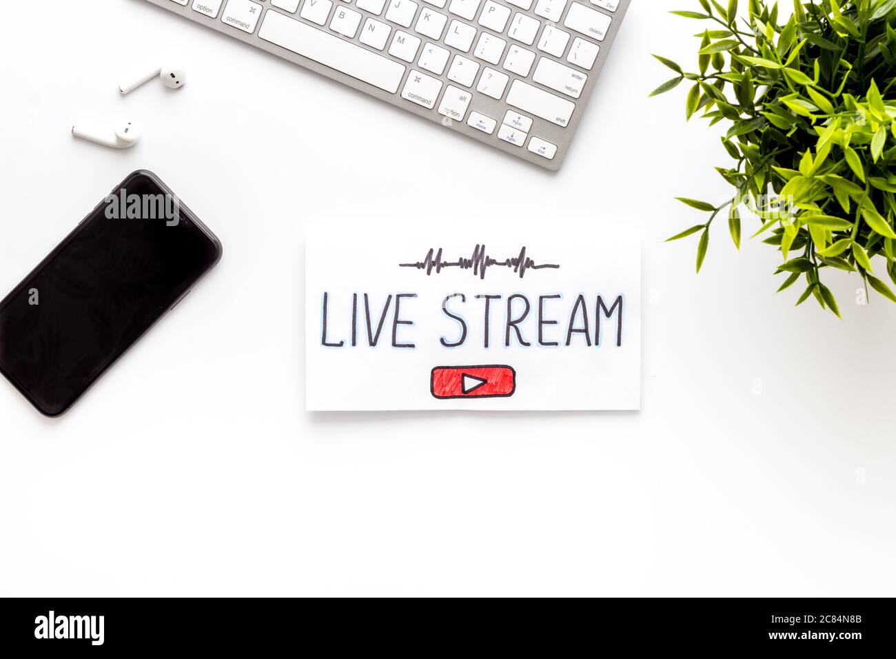 Online streaming social media concept. Paper tablet on office desk top ...