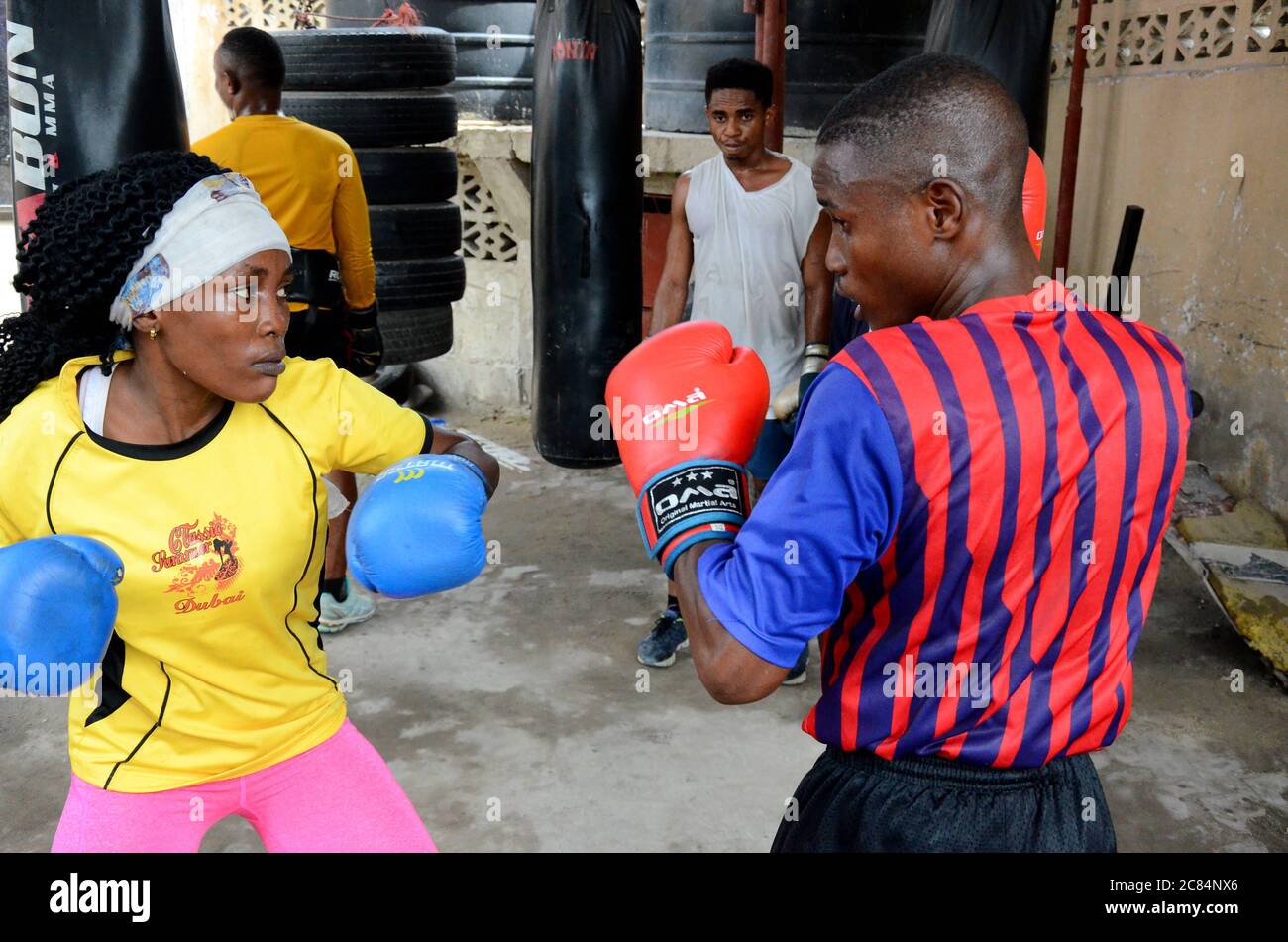 Dar Es Salaam. 21st July, 2020. Female boxer Jesca Mfinanga (L) trains ...