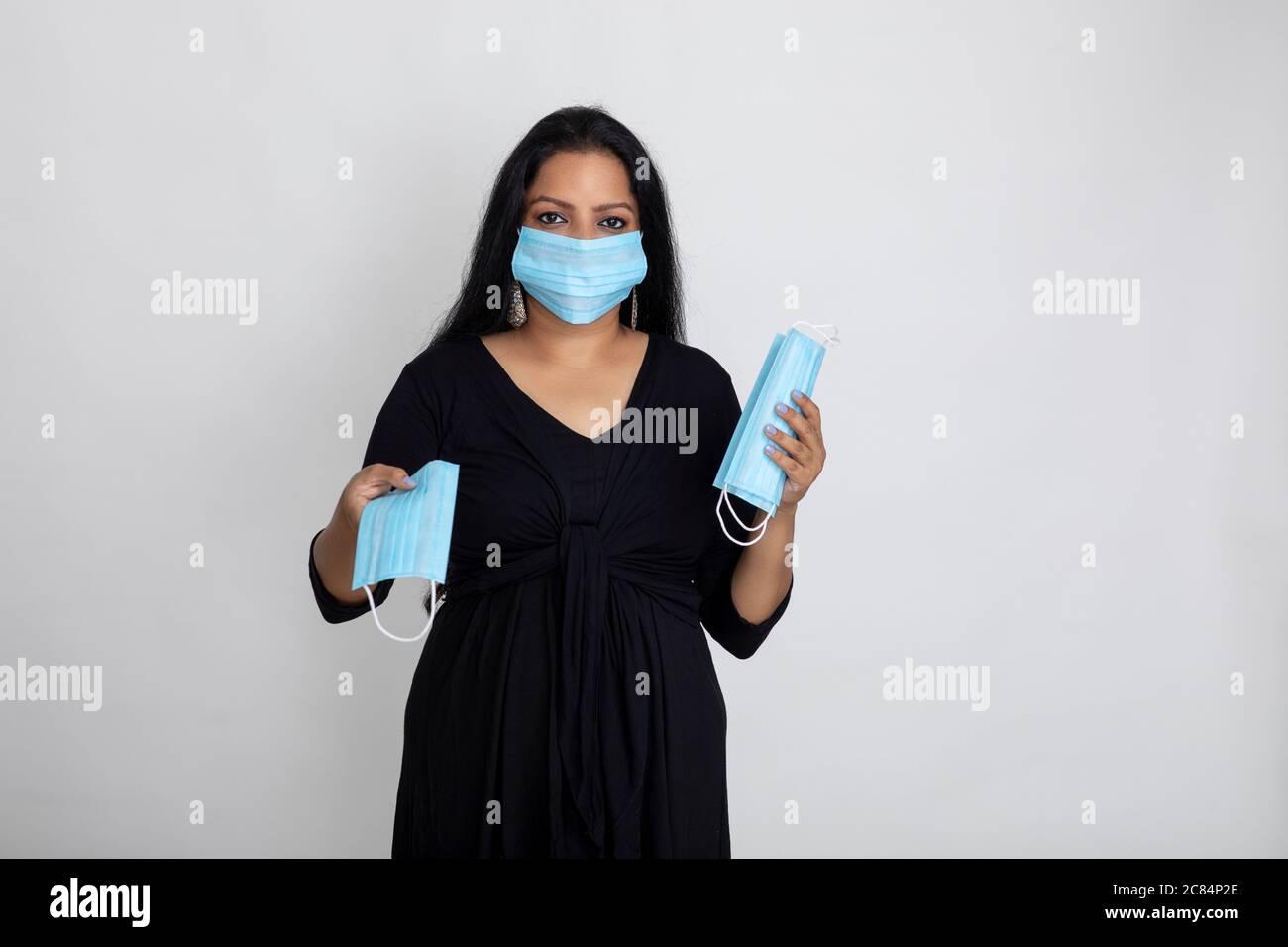 Indian woman wearing Covid protection mask, Lady displays mask and ...