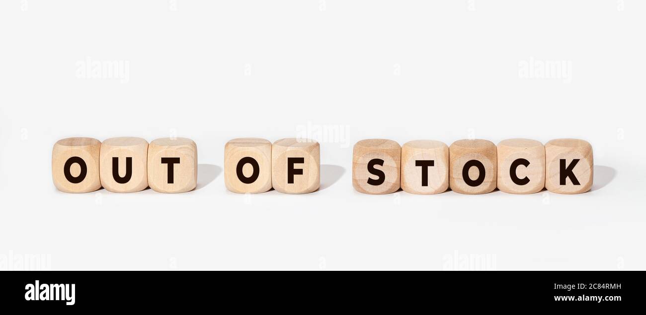 Out of stock concept. Sign in wooden blocks on white background. Copy ...