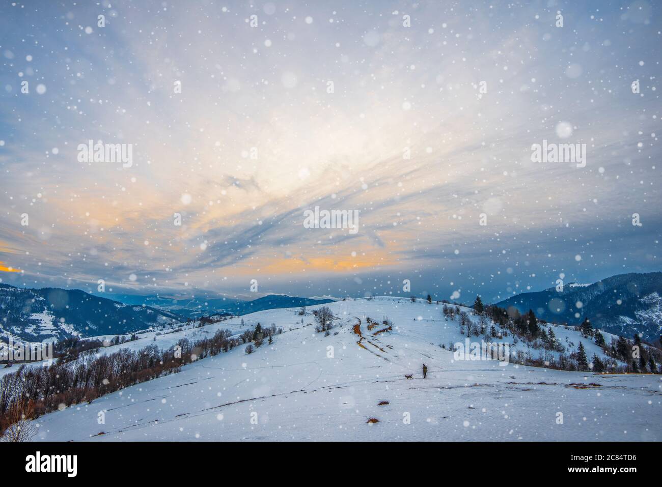 Beautiful panorama of the mountain ranges covered with snow and divided ...