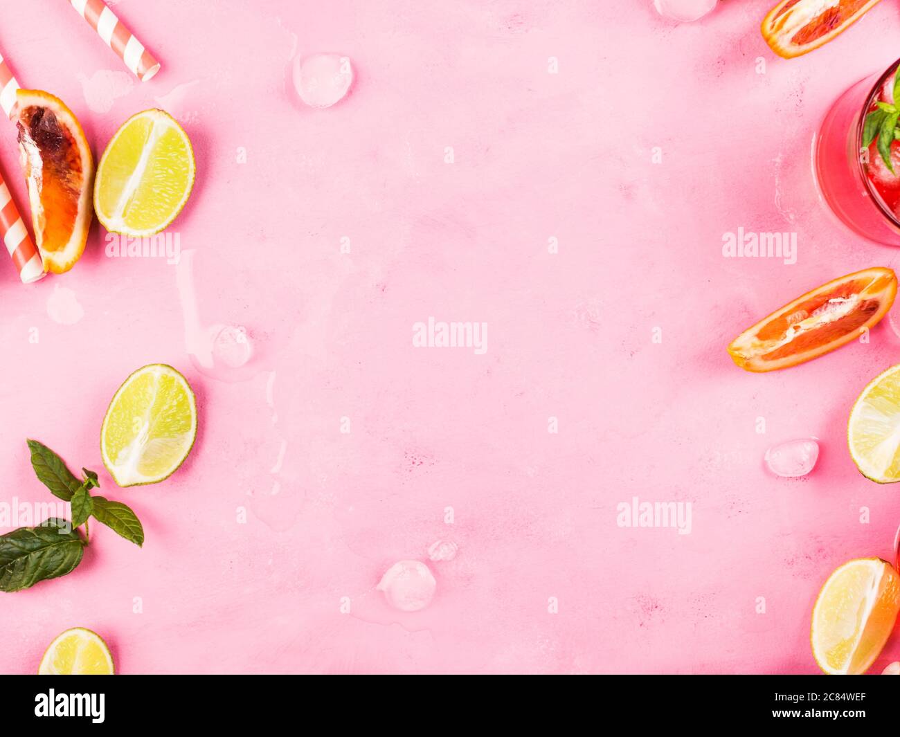 Summer pink background with citrus slices Stock Photo - Alamy