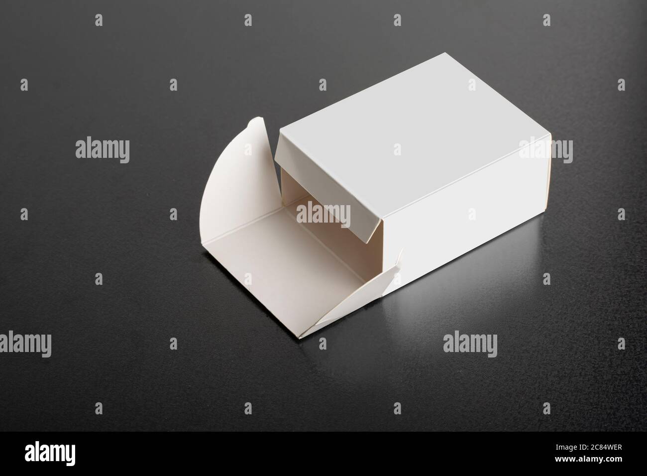 Opened needle tips package on dark background, editable mock-up series ...