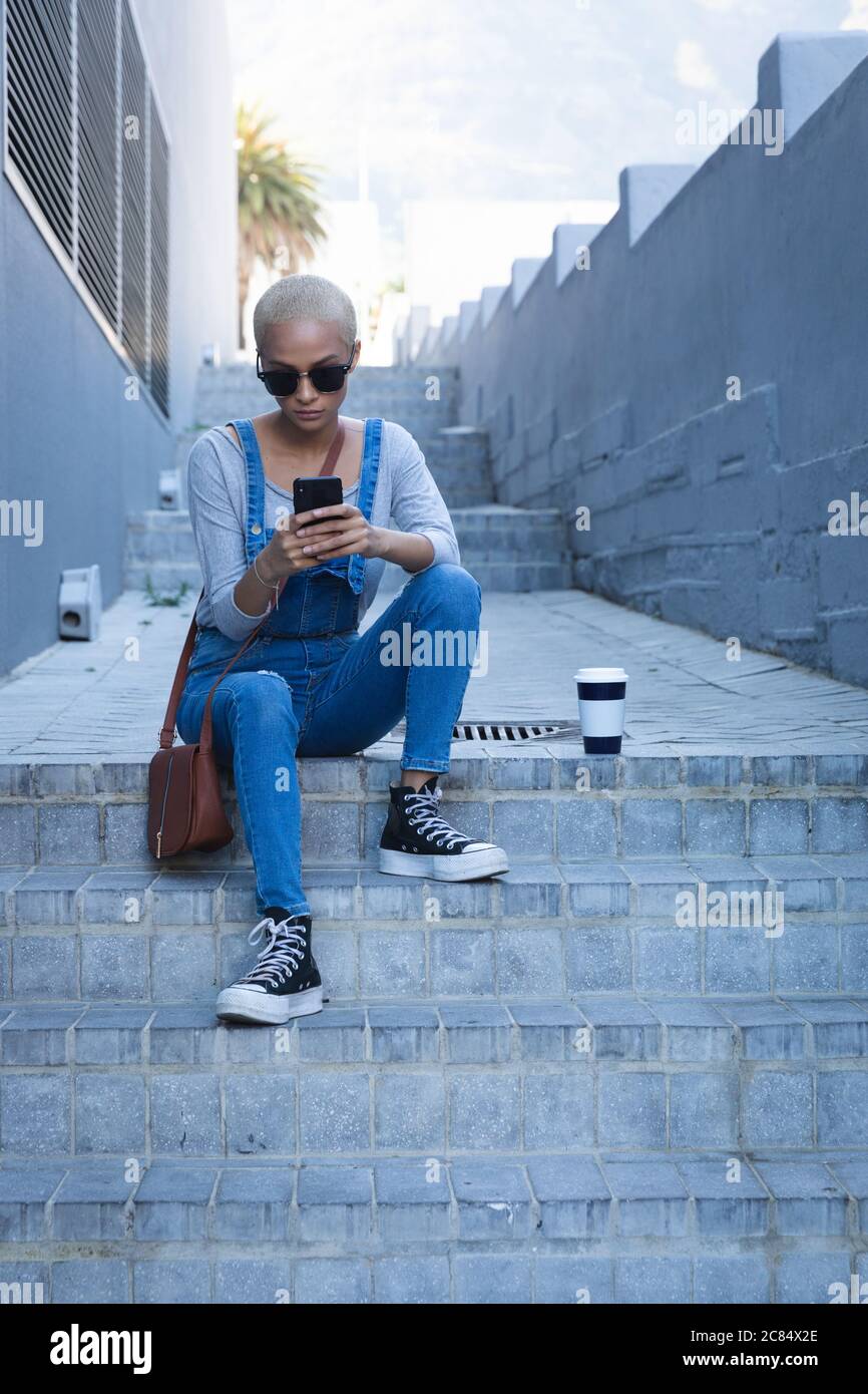 Mixed race alternative woman with short blonde hair out and about in ...