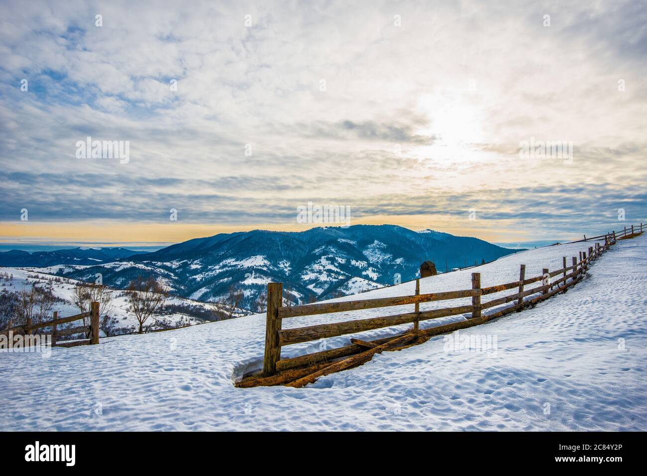Beautiful panorama of the mountain ranges covered with snow and divided ...