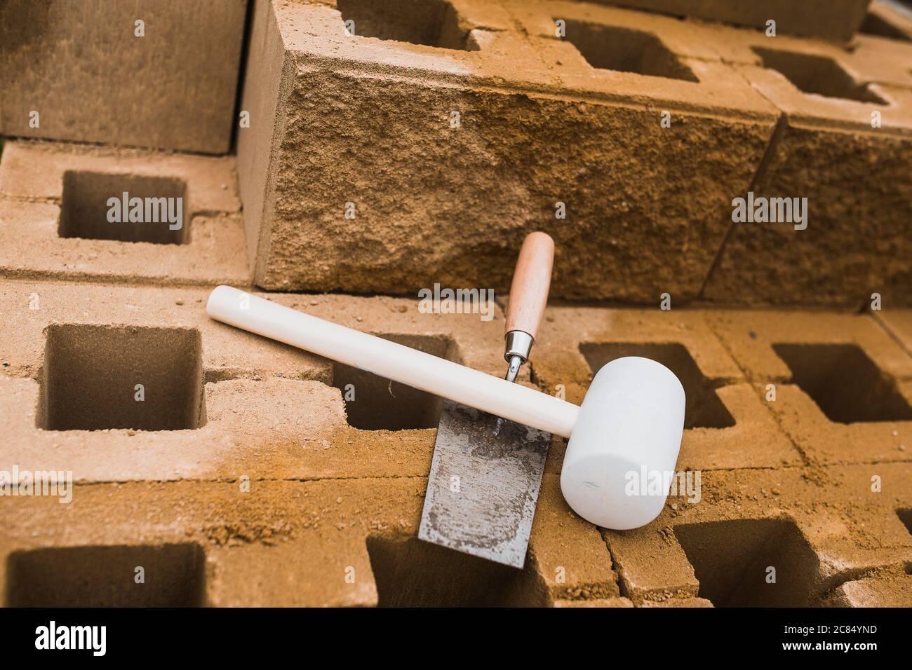 Trowel and mallet - working tools of a professional bricklayer in the ...