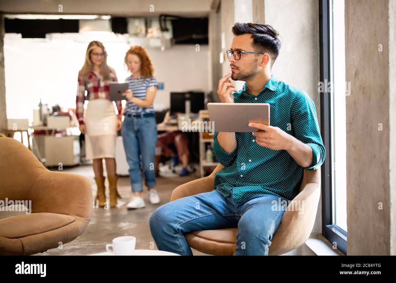 Company employees working in software development and designer office ...