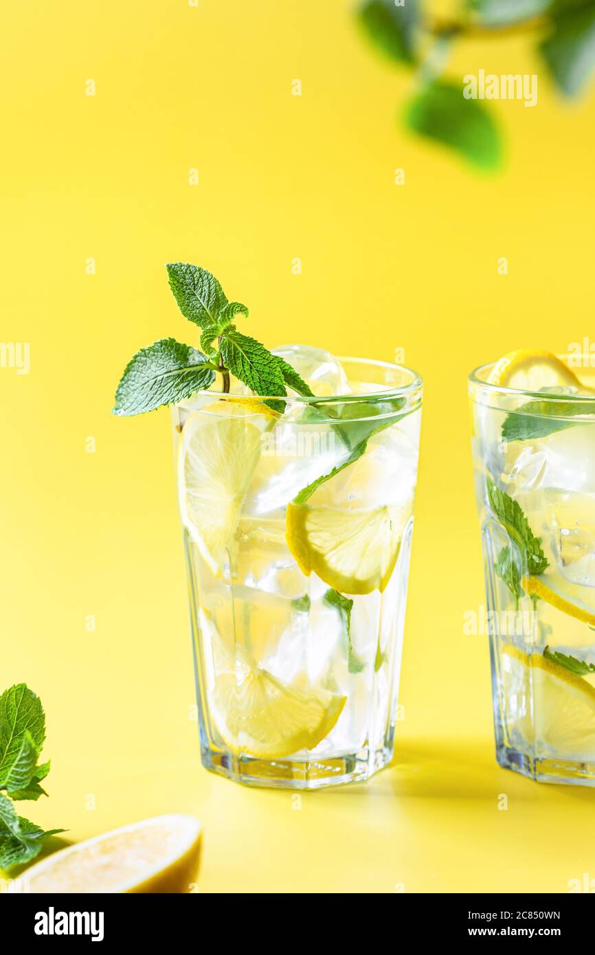 Lemonade on yellow background. Minimal styled summer drink Stock Photo ...