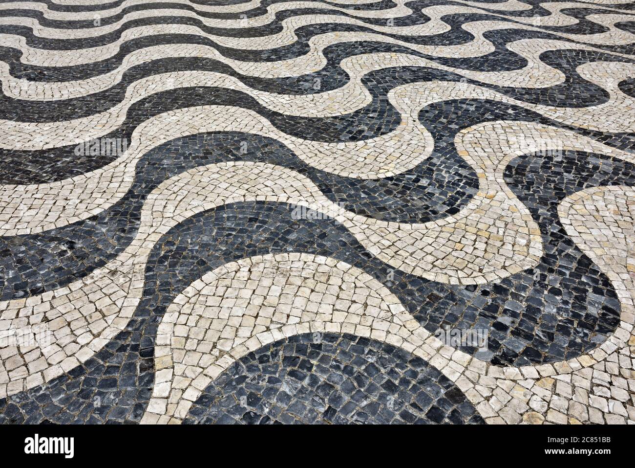 Medieval cobbled square in wave design, Portugal Stock Photo - Alamy