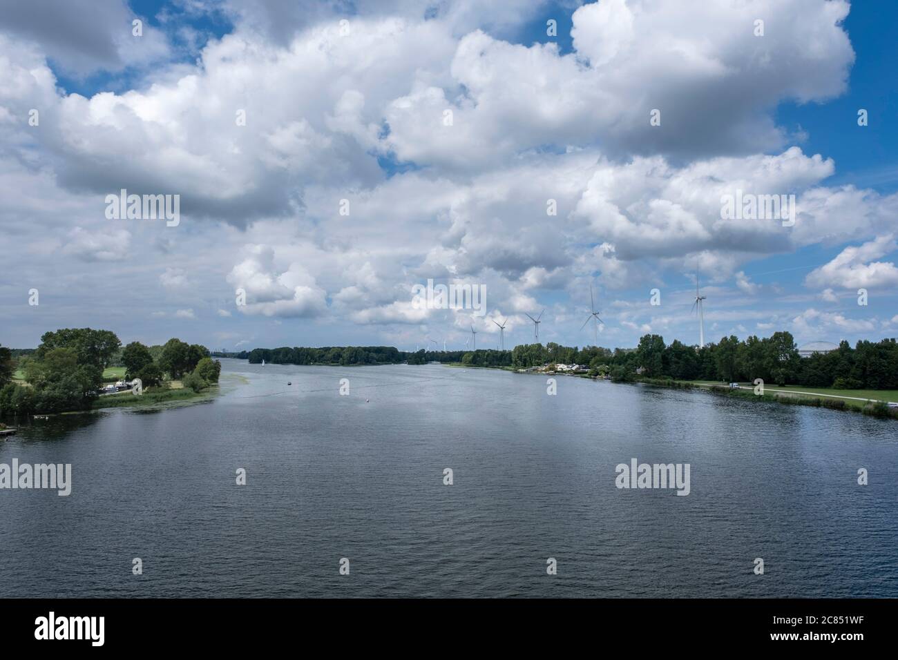 Row of wind turbines and trees at Lake Brielse Meer near Brielle ...