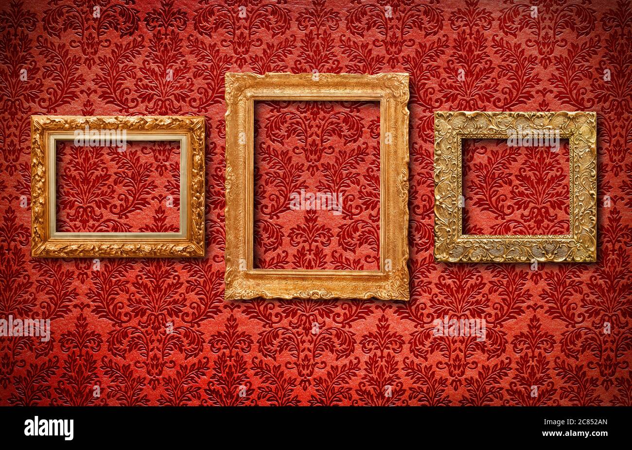 Antique picture frames on wallpaper Stock Photo - Alamy
