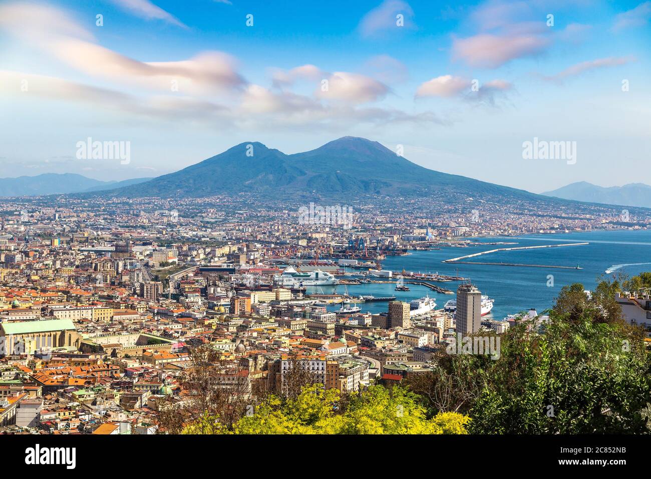 Napoli (Naples) and mount Vesuvius in the background at sunset in a ...