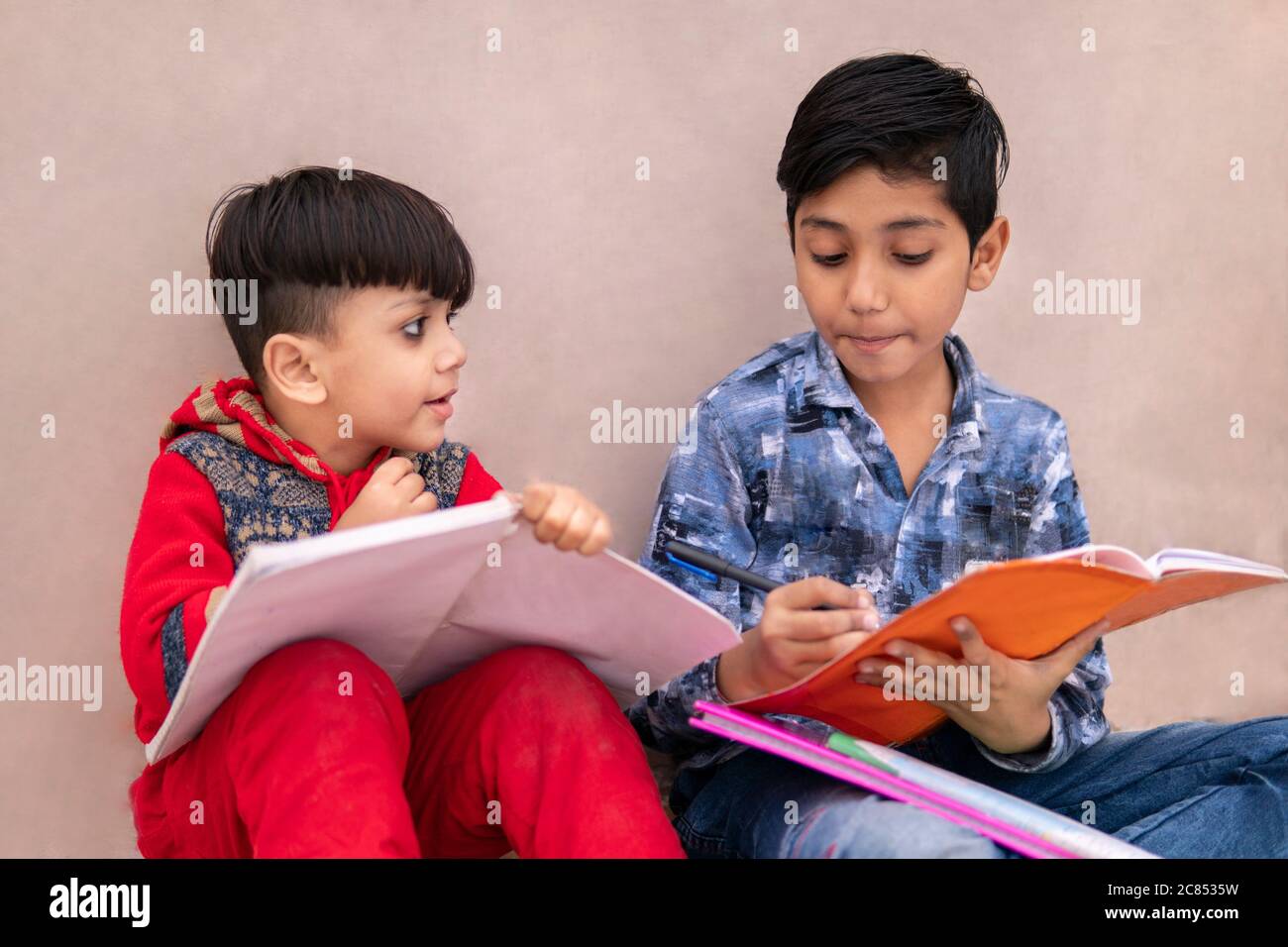 Two boys studying together hi-res stock photography and images - Alamy